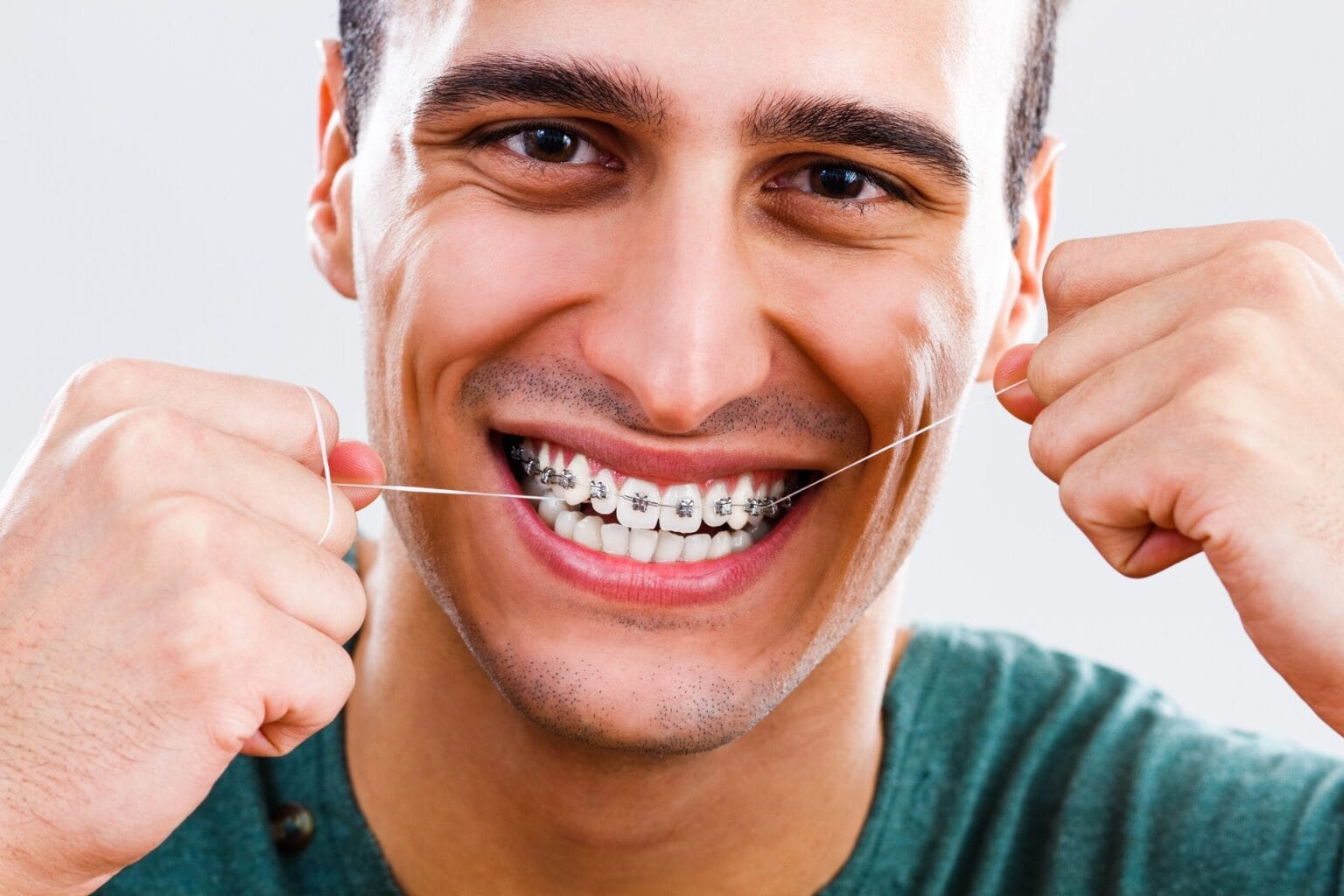 The Difference Between Waxed and Non-waxed Floss - Hansen Orthodontics